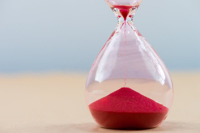 Hourglass with Flowing Sand on Table. Time Management Stock Photo ...