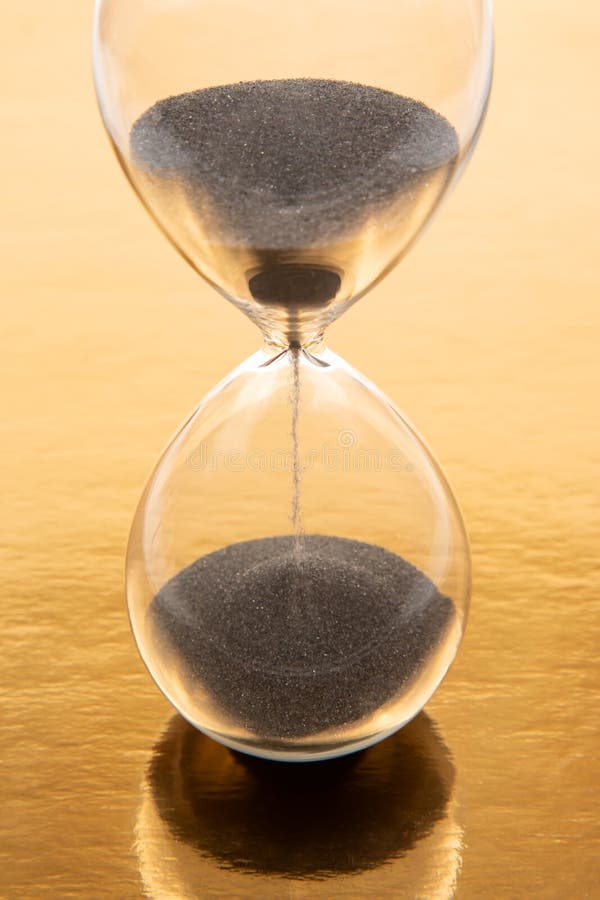 Hourglass on a Golden Background. Time and Minute Measurement Stock ...