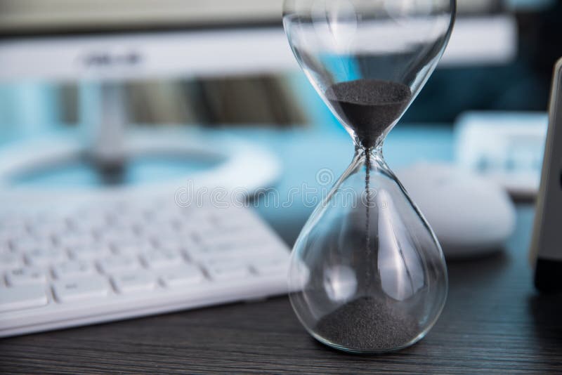 Hourglass with keyboard stock photo. Image of clock - 194583882