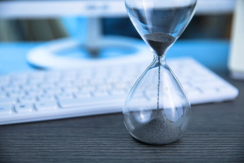 Hourglass with keyboard stock image. Image of hourglass - 195252227