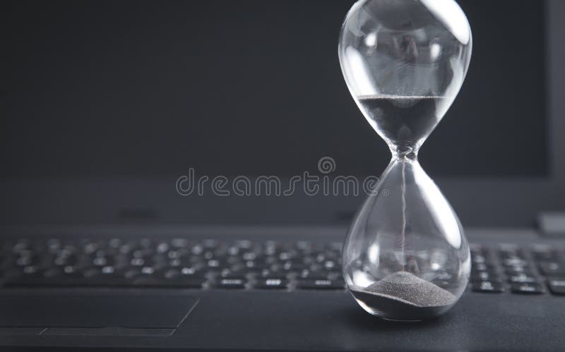 Hourglass on Laptop Keyboard. Time Stock Photo - Image of glass ...