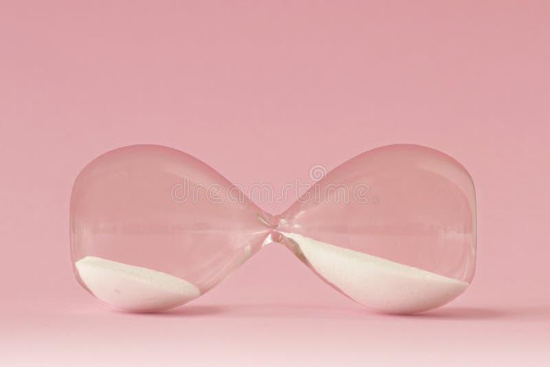 Hourglass Lying on Pink Background - Concept of Time and Woman Stock ...