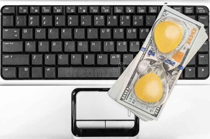 Hourglass with Money on Laptop Keyboard. Top View Stock Photo - Image ...