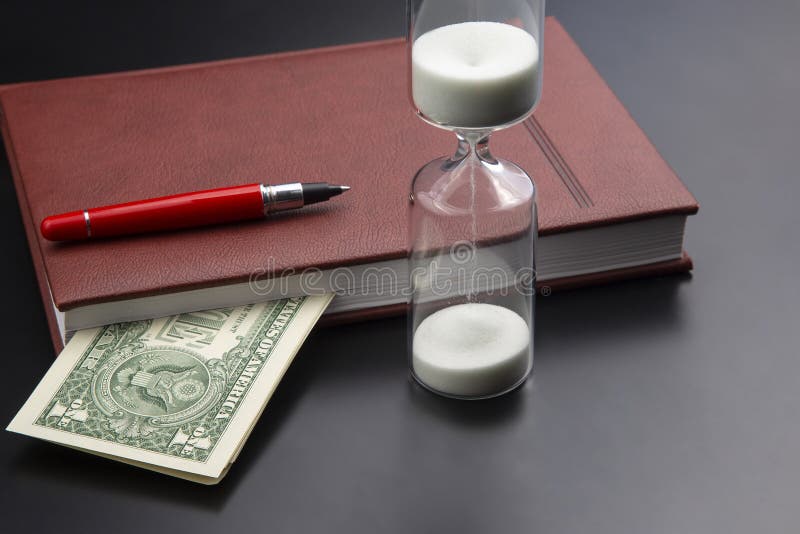 Hourglass, Money, Pen and Notebook are on the Table. Business Office ...