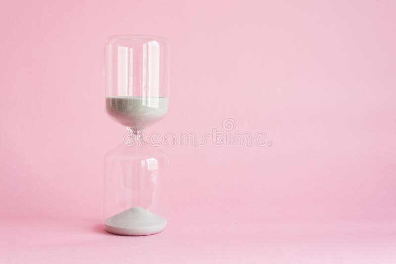 Hourglass On Pink Background - Concept Of Health, Fertility And ...