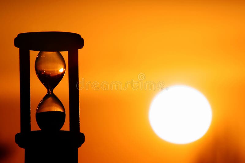 Hourglass in sunset stock image. Image of reflection, marketing - 1812905