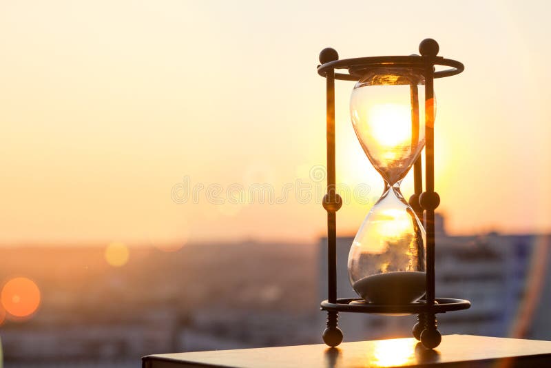 Hourglass at sunset stock photo. Image of happiness, morning - 59600436