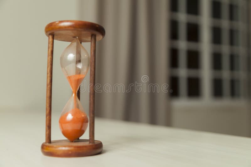 Hourglass on the Table Counting Down. Stock Photo - Image of element ...