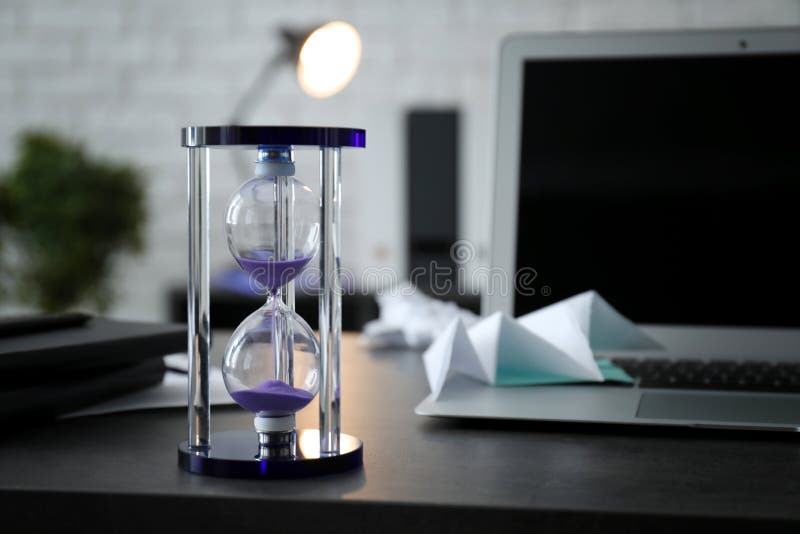 Hourglass on Table in Office. Time Management Concept Stock Image ...