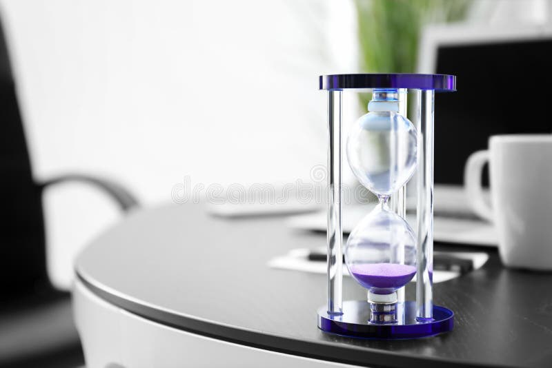Hourglass on Table in Office. Time Management Concept Stock Image ...