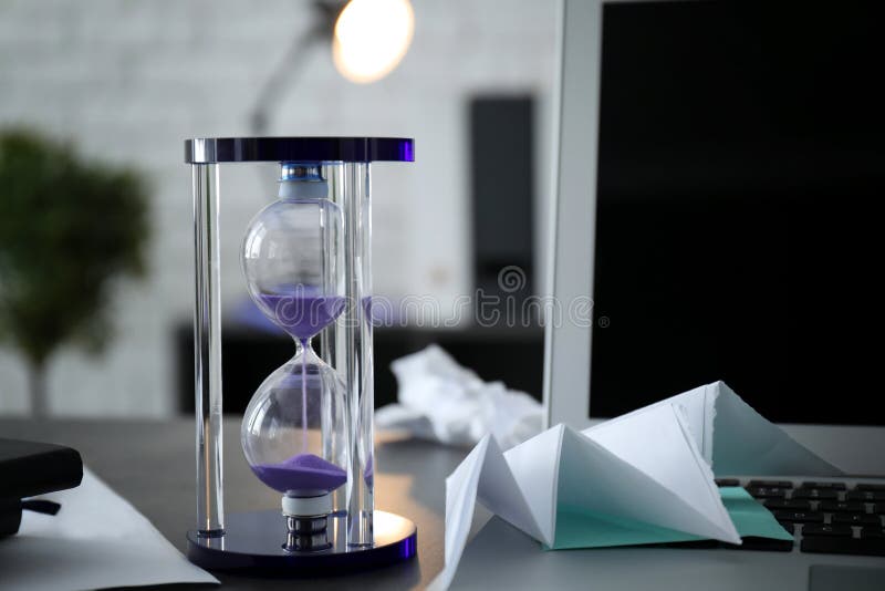Hourglass on Table in Office. Time Management Concept Stock Image ...
