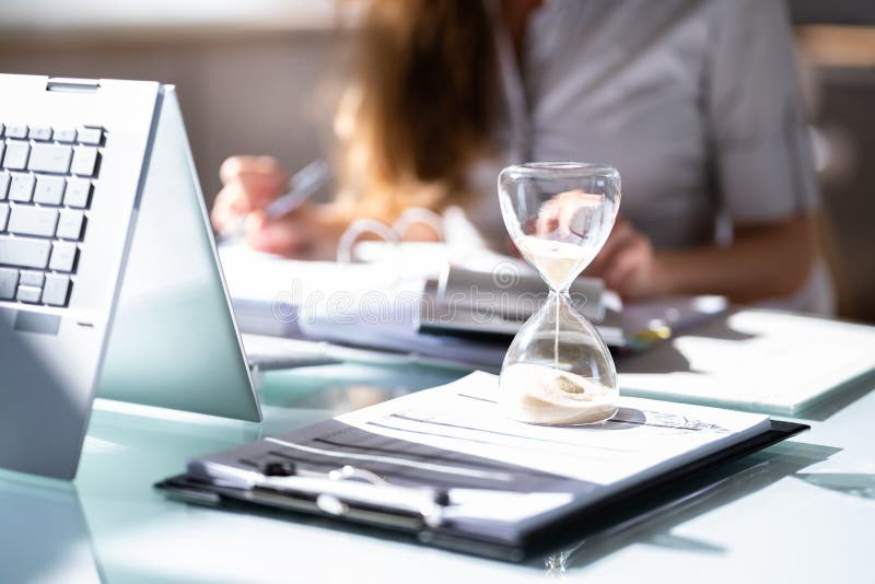 Hourglass and Time Crunch with Document Stock Photo - Image of employee ...