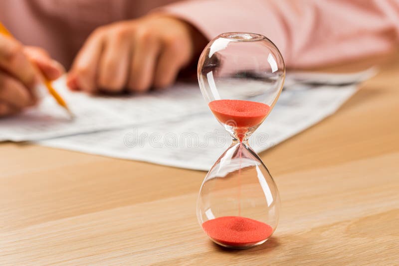 Hourglass with Time Running Out and Student Hand Testing in Exercise ...