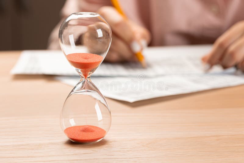 Hourglass with Time Running Out and Student Hand Testing in Exercise ...