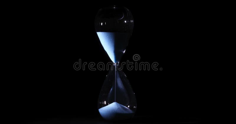 Hourglass Timer with Blue Sand Marks Passage of Time Stock Video ...