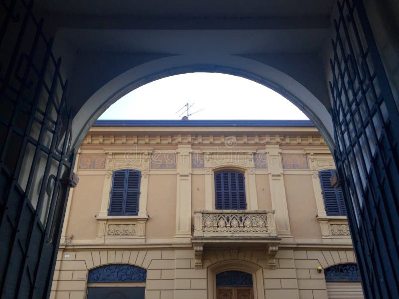 House through archway stock photo. Image of shuttered - 57280810