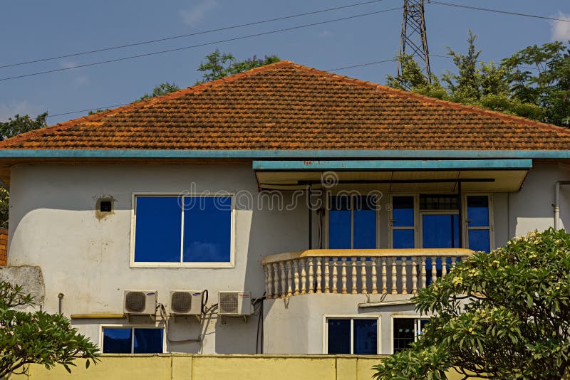 A house with blue windows stock photo. Image of travel - 152668370