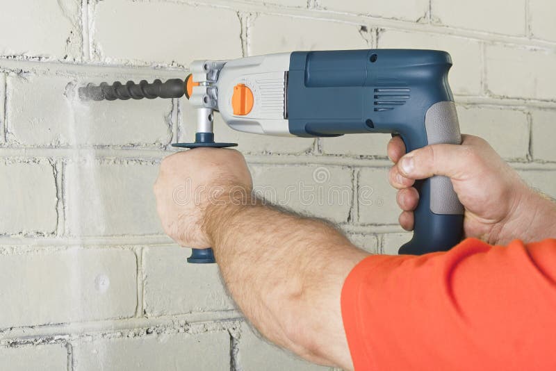House-builder Working with a Perforator Stock Photo - Image of building ...