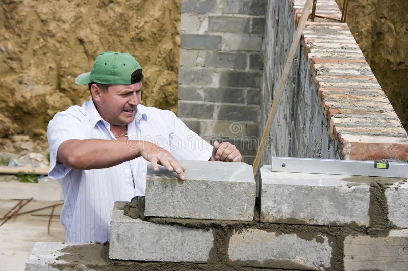 House builder at work stock image. Image of contractor - 5463431