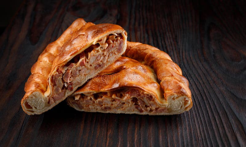 The House Cake Cut into Two Pieces Lies on a Wooden Surface Stock Image ...
