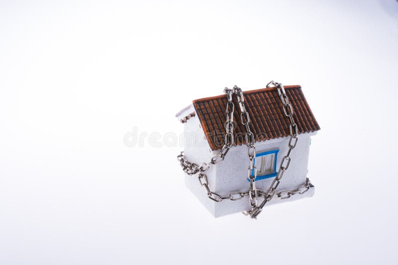 House in Chains and Money Downdrain Stock Photo - Image of home ...