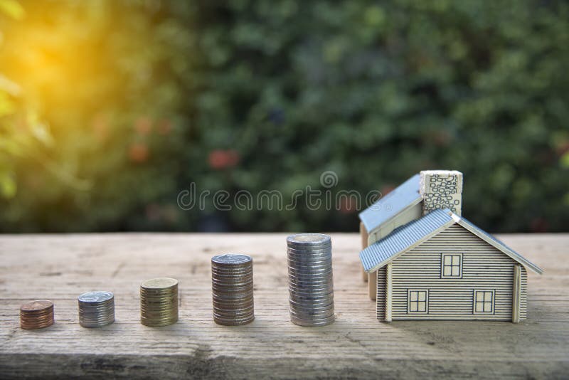 House and Coins Stack. the Concept of Purchase of Habitation, Buy a ...