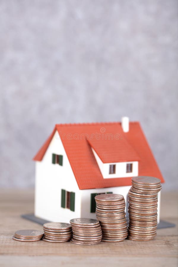 House and coins on table stock image. Image of transactions - 254910545