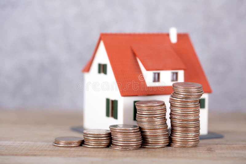 House and coins on table stock image. Image of bubbles - 254910533