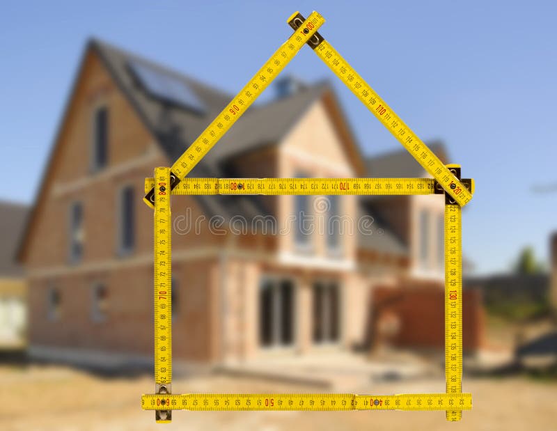 House Construction in the Shell with a Folding Rule Stock Photo - Image ...