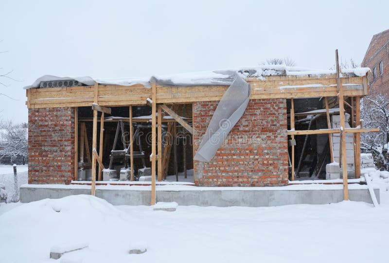 House Construction Site in Winter. Building House Construction during ...