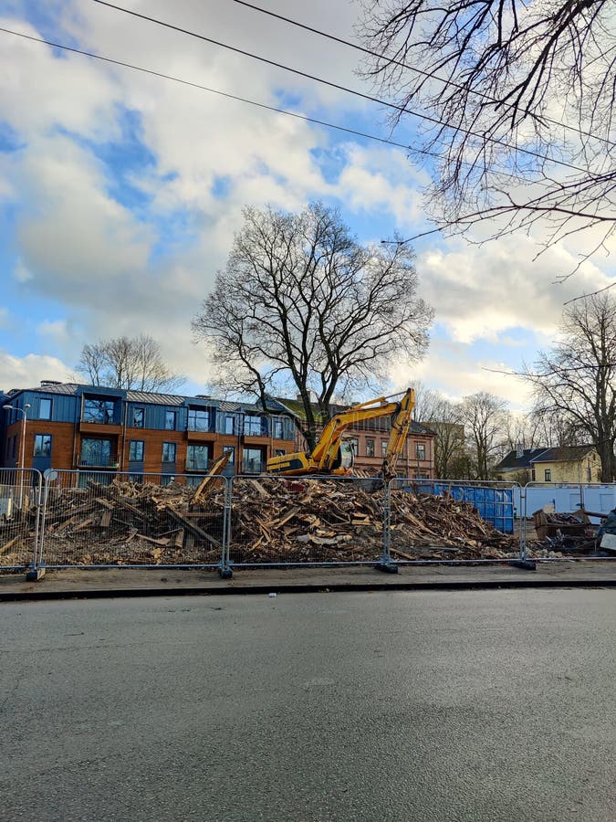 House Demolition Using an Excavator. Bulldozer Crushing an Old Building ...