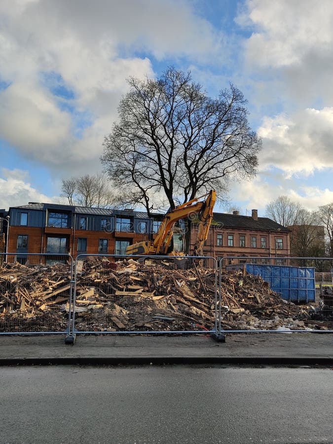 House Demolition Using an Excavator. Bulldozer Crushing an Old Building ...
