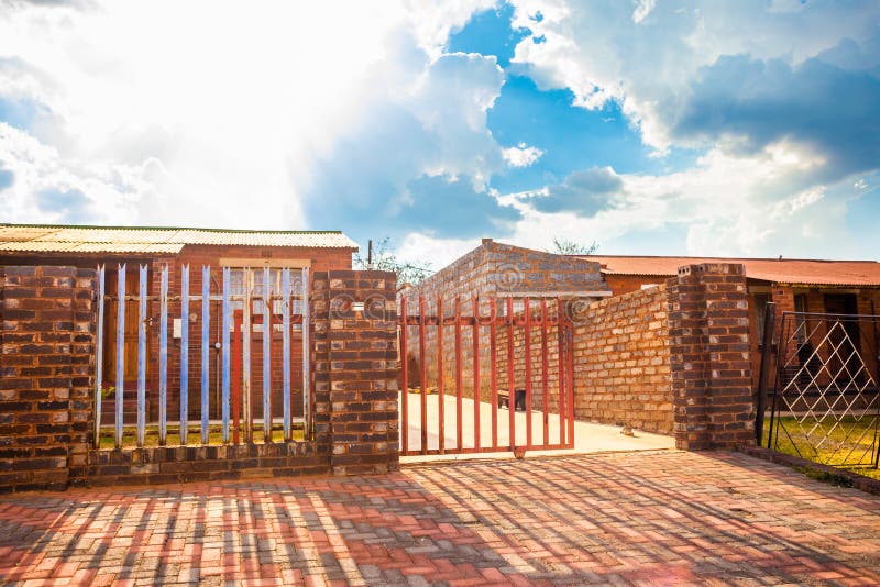 House with Driveway Gate, Soweto Stock Photo - Image of fences, match ...