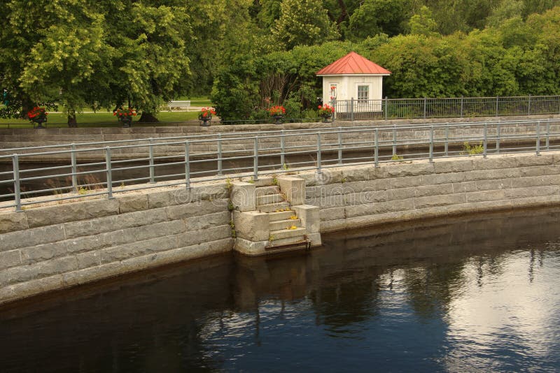 House on the embankment stock image. Image of pond, mound - 97183363