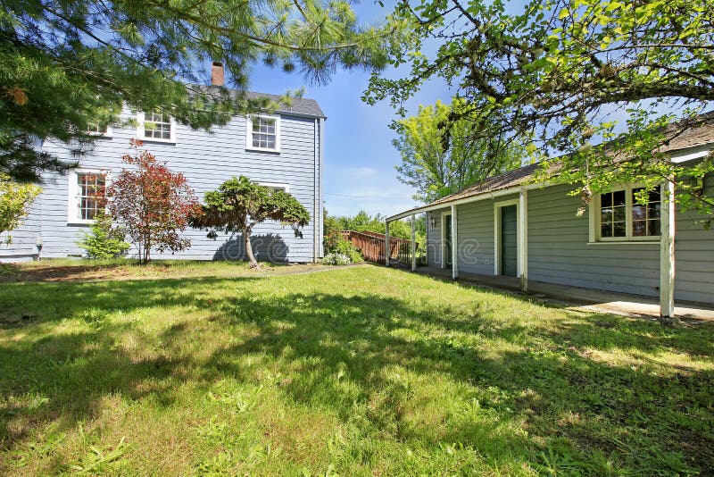 House Exterior. View of Grassy Back Yard with Shed. Stock Photo - Image ...