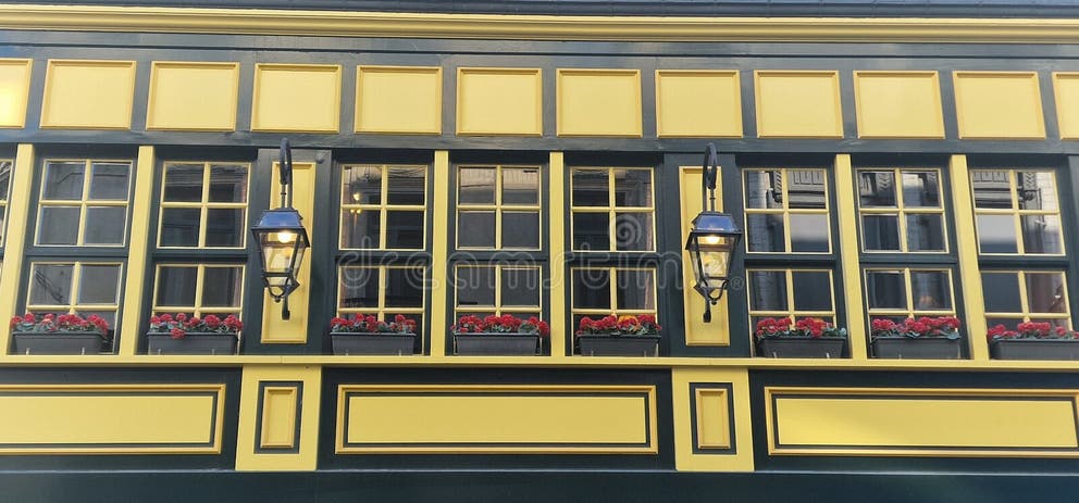 House Facade with Elongated Rectangular Windows with Square Panes in an ...