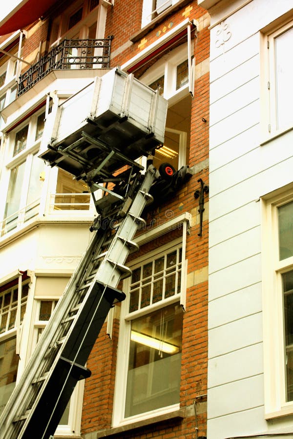 House Facade with a Lifting Machine in Amsterdam, Holland. Stock Photo ...