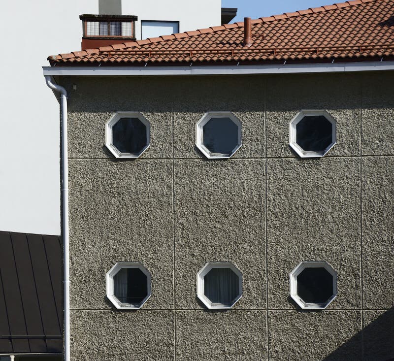 House Facade with Octagonal Windows Stock Photo - Image of wall ...