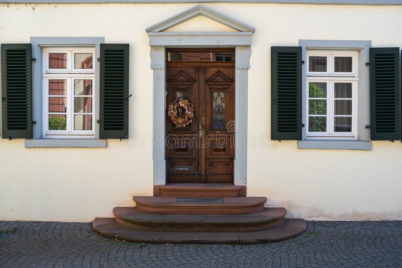 House Facade with Two Windows and a Door Stock Photo - Image of aged ...