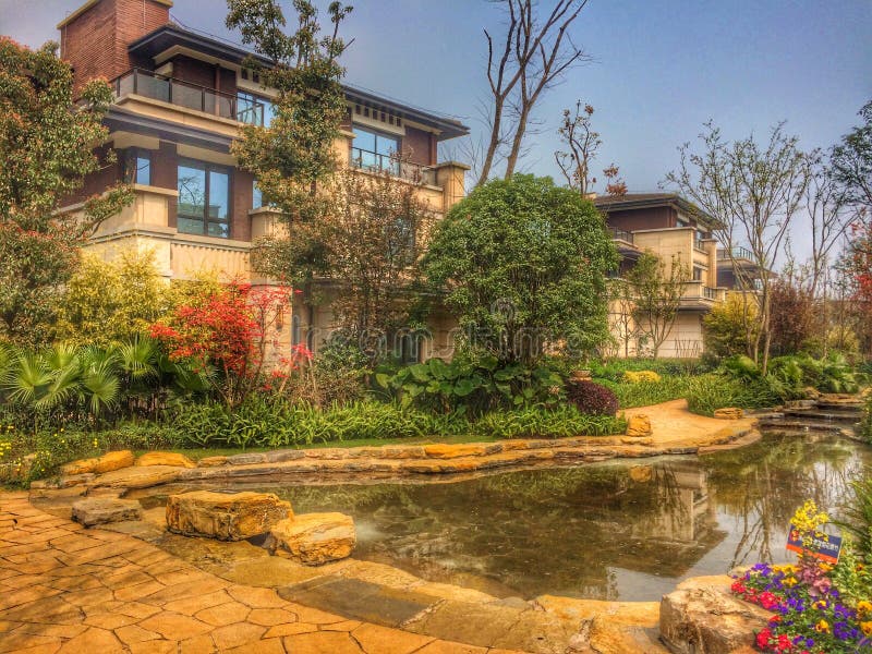 House and garden stock photo. Image of landscaped, spring - 51689176