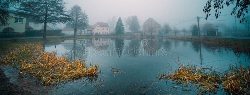 House in a German Village with Reflection in a Pond or Lake Stock Photo ...