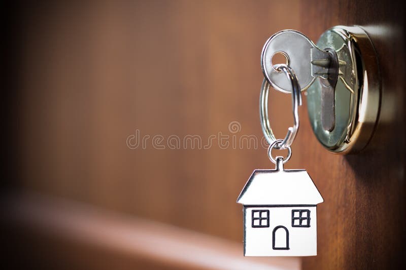 House key in the door stock photo. Image of keyring - 140611330
