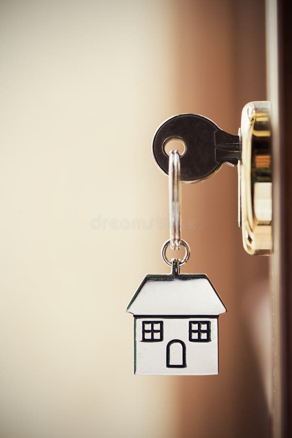 House key in the door stock photo. Image of real, opening - 100640000