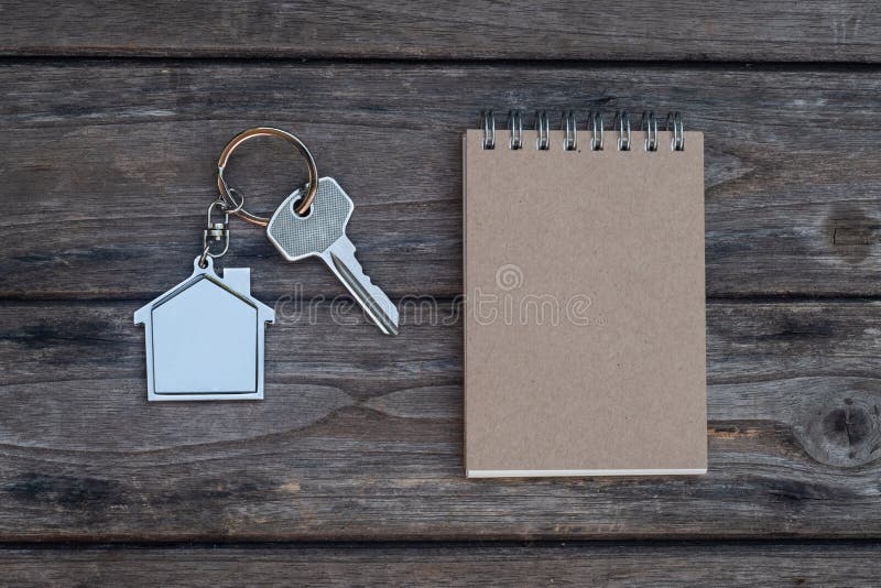 House Key with Home Keyring in on Old Wood Background Stock Photo ...
