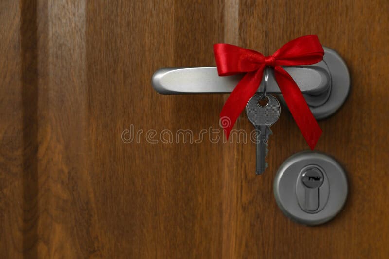 House Key with Red Bow on Door Handle, Closeup. Housewarming Party ...