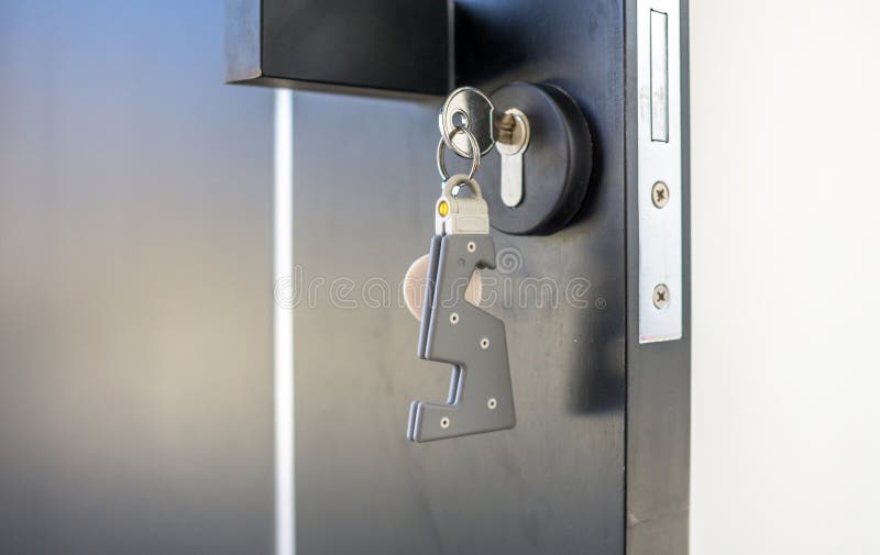 A House Key with a Key Ring Inserted at the Door Lock Stock Image ...