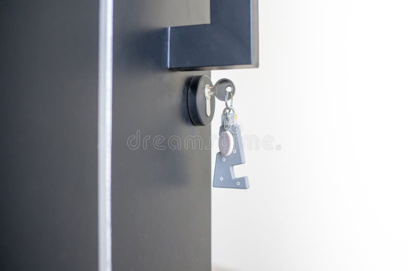 A House Key with a Key Ring Inserted at the Door Lock Stock Image ...