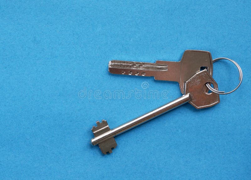 House Keys on a Blue Background Close-up Stock Image - Image of ...