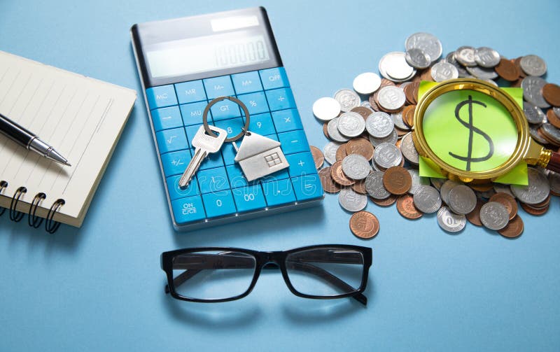 House Keys, Calculator and Stack of Coins Stock Photo - Image of ...