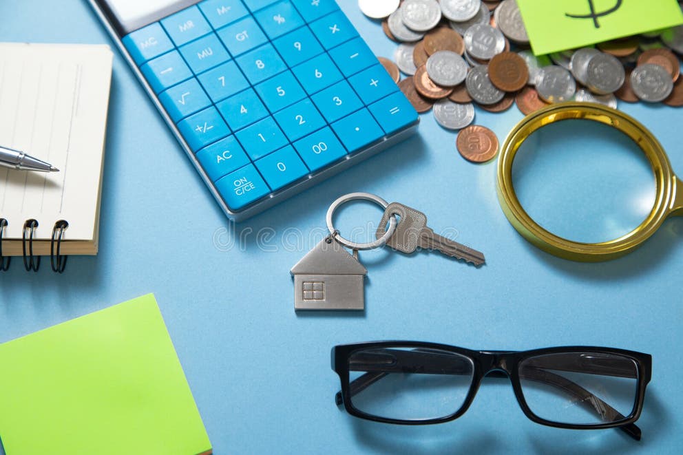 House Keys, Calculator and Stack of Coins Stock Photo - Image of ...